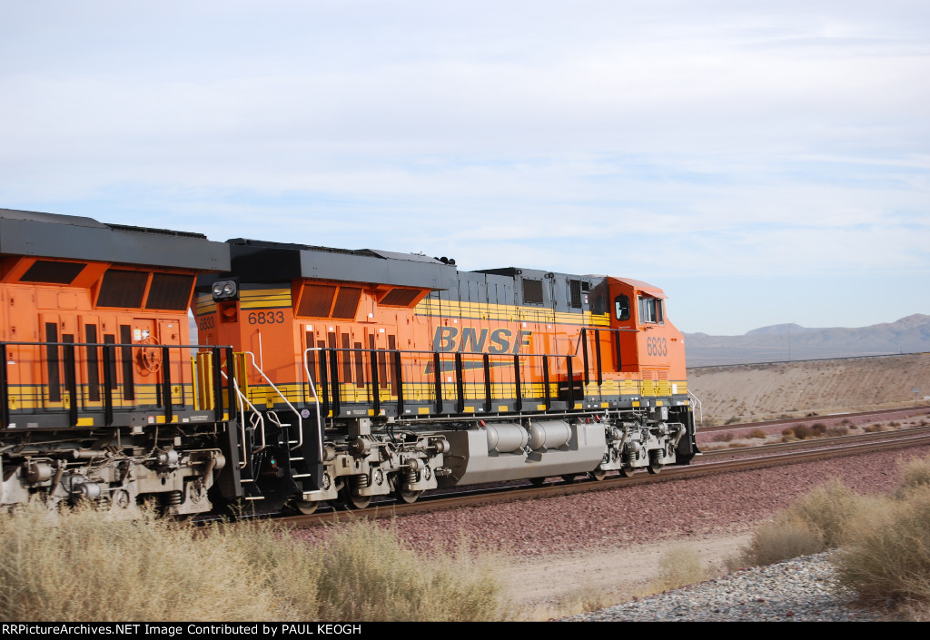 BNSF 6833 a Very, Very Brand New ES44C4 passses me by as the Sun Shines off Her GE/BNSF Swoosh ...